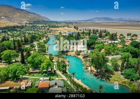 Turquoise water of the river running through Nir David Kibbutz in ...