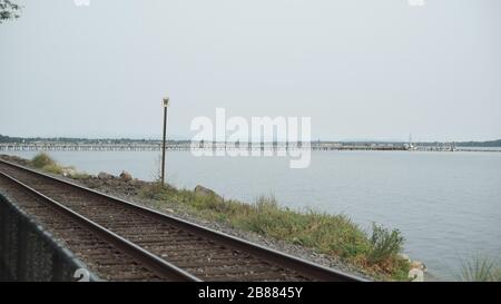 Horizon line of a pier near a train track in White Rock BC Stock Photo ...
