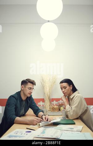 Businessman looking at financial charts and graphs Stock Photo - Alamy