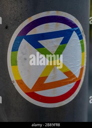 A rainbow coloured Extinction Rebellion Sticker Stock Photo - Alamy