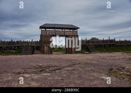An old military fortress built of coniferous logs. At the corners of ...