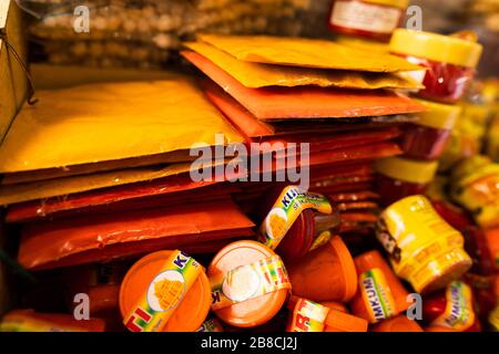 Bunch Pasupu,Kumkuma Packets in a street shop at tirumala Stock Photo ...