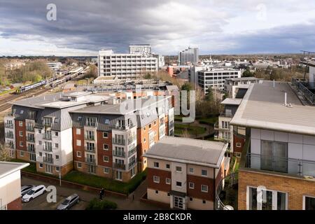 Aerial view across Basingstoke town centre: railway station, Winterthur ...