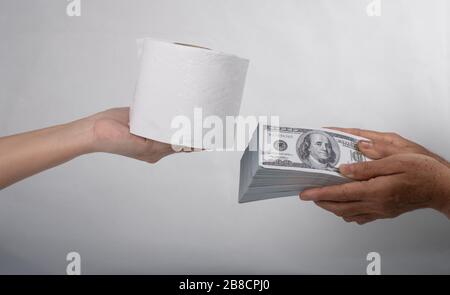 Close up sell-buy tissue, handholds toilet paper tissue and money of ...