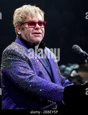Singer Elton John performs drummer Nigel Olsson and the rest of the ...