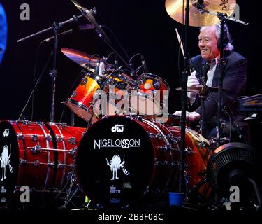 Singer Elton John performs drummer Nigel Olsson and the rest of the ...