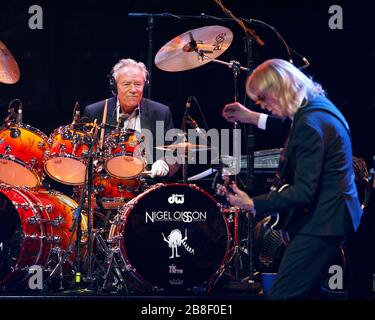 Singer Elton John performs drummer Nigel Olsson and the rest of the ...