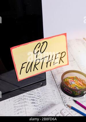 Writing note showing Go Further. Business concept for To make a bolder ...