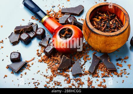 Chocolate flavored tobacco for smoking pipes.Tobacco pipe filled with ...