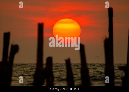 The sun is falling into the sea. The light reflected from the sea and ...
