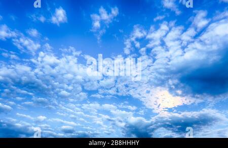 Dramatic dark clouds with bright light breaking through the overcast ...