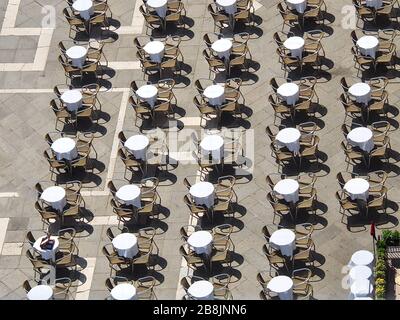 Aerial view of empty gastronomy chairs and tables in Venice Stock Photo ...