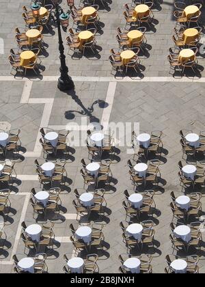 Aerial view of empty gastronomy chairs and tables in Venice Stock Photo ...