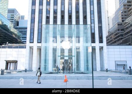 The iconic glass cube Apple Store where customers descend into the ...