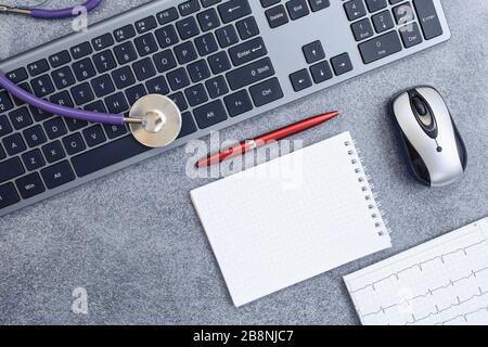 Notepad or notebook,medical stethoscope with pencil on brown wood table ...