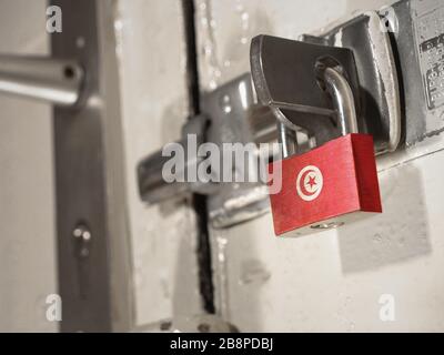 Tunisia flag on door with padlock Stock Photo - Alamy