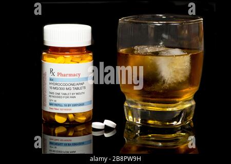 Alcohol and pill danger mix Stock Photo - Alamy