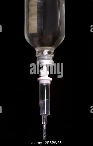 IV drip chamber, IV tubing, and IV bag of solution with copy space ...