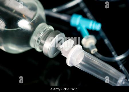 IV drip chamber, IV tubing, and IV bag of solution with copy space ...