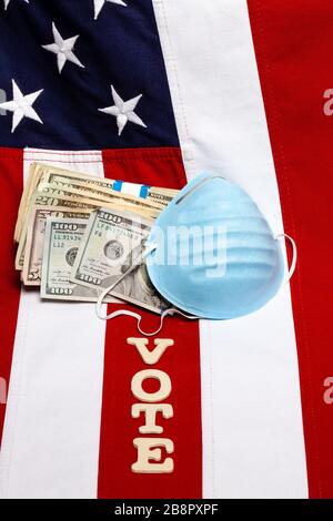 Respirator mask with cash money and the words vote in front of the ...