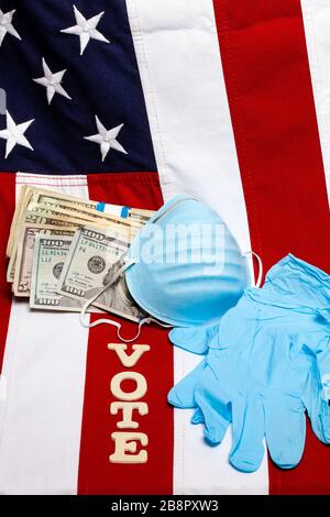 Respirator mask with cash money and the words vote in front of the ...
