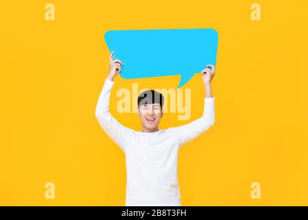 Excited man say wow, holding laptop for work and coffee in paper cup ...