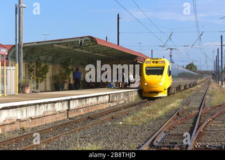 Queensland Rail Tilt train crossing Bourbong Street at Bundaberg ...