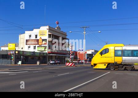 Queensland Rail tilt train crossing the Burnett River railway bridge ...