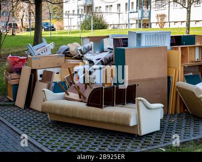 A large pile of bulky waste with old furniture and electrical items ...