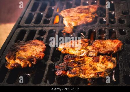 Pork steaks on the grill. Serbian barbecue Stock Photo - Alamy