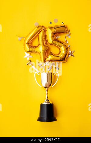 Golden number 45 fourty five made of inflatable balloon on white Stock ...