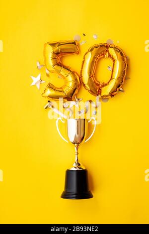 Gold foil number 50 celebration balloon Stock Photo - Alamy