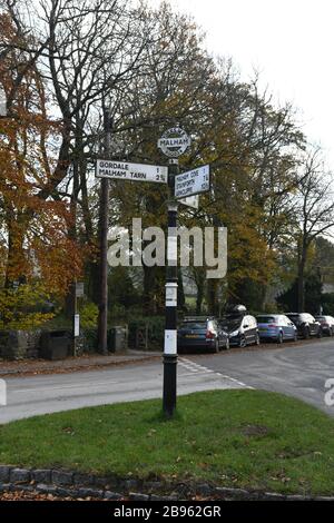 The road sign by The Buck Inn (Public House and Hotel) Malham, Skipton ...