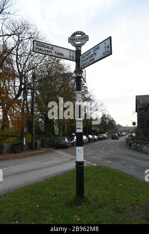 The road sign by The Buck Inn (Public House and Hotel) Malham, Skipton ...