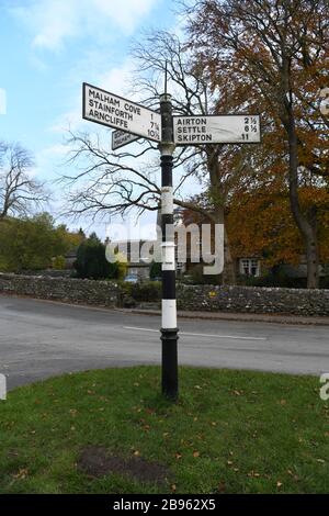 The road sign by The Buck Inn (Public House and Hotel) Malham, Skipton ...