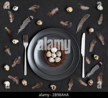 Easter table setting with quail eggs Stock Photo - Alamy