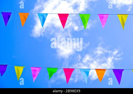 Strings of vibrant color flags / pennants Stock Photo - Alamy