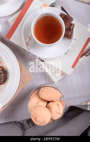 Breakfast with snacks and tea on wooden table Stock Photo - Alamy