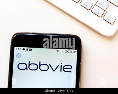 In this photo illustration, the AbbVie logo is displayed on a ...
