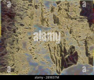 Man sitting at base of cliff wall. Unknown Stock Photo - Alamy