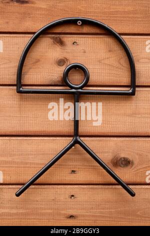 Metal Indalo Man Symbol on a wooden fence. The Indalo is an ancient ...