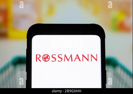 In this photo illustration a Rossman logo seen displayed on a ...
