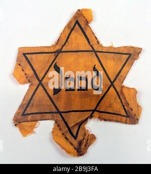 The yellow badge that Jews were ordered to sew on their outer garments ...