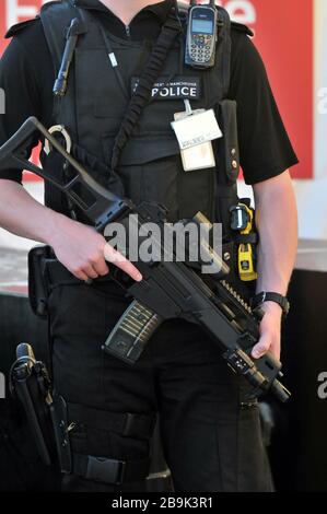 British Police Officer With Taser Gun, London, England Stock Photo - Alamy