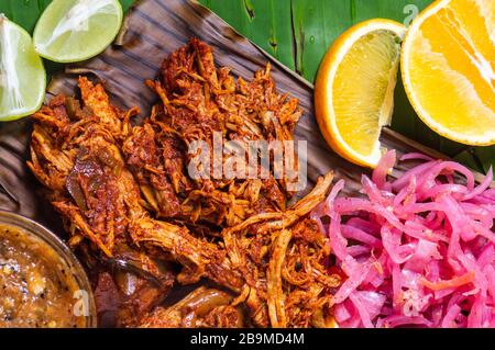 Cochinita Pibil, Mexican pit-roasted pork dish from Yucatan peninsula ...