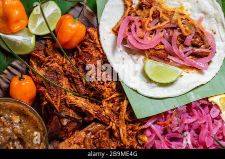 Cochinita Pibil, Mexican pit-roasted pork dish from Yucatan peninsula ...