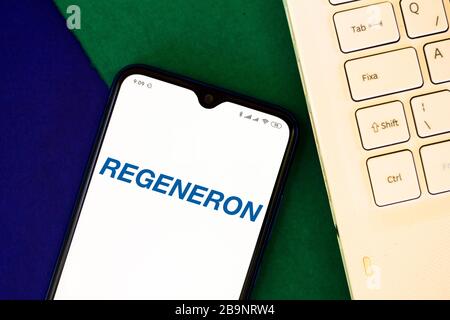 In this photo illustration, Regeneron logo of Regeneron Pharmaceuticals ...