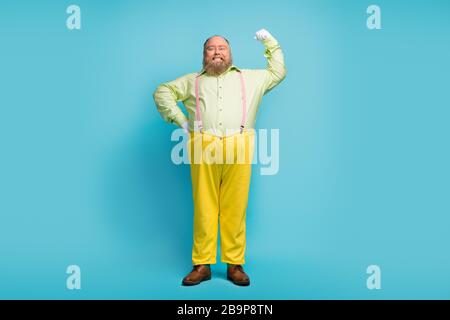 The strong and fat man showing his muscles and belly Stock Photo - Alamy