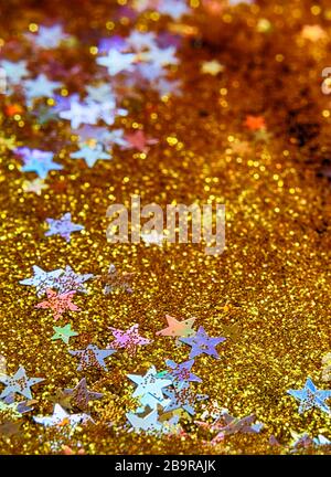 golden sparkles and multicolour stars background Stock Photo - Alamy