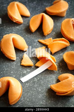 Fortune cookies, one cookie is cracked. Top view Stock Photo - Alamy